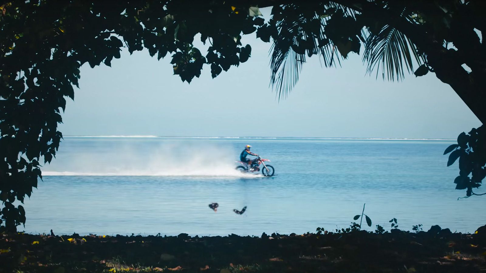 Yes, this man really is surfing on a motorbike